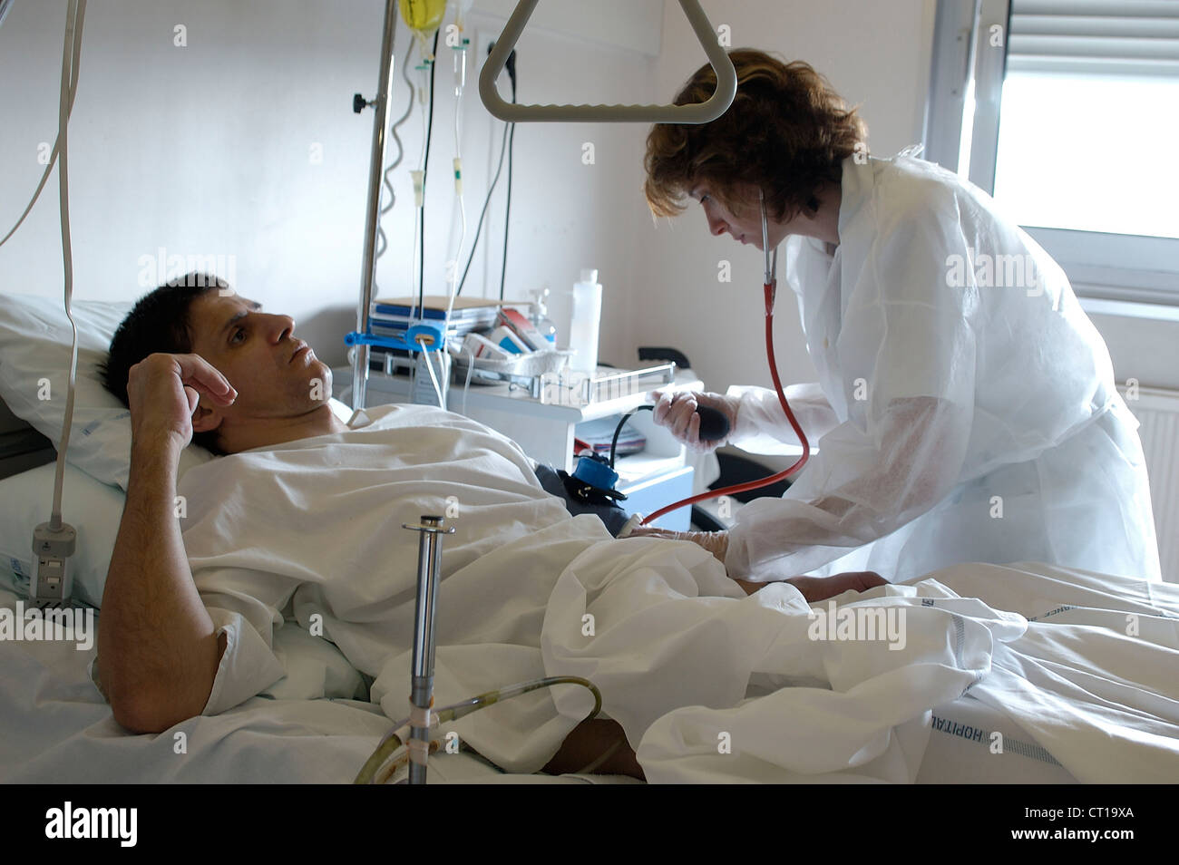 MAN HOSPITAL PATIENT W. NURSE Stock Photo - Alamy