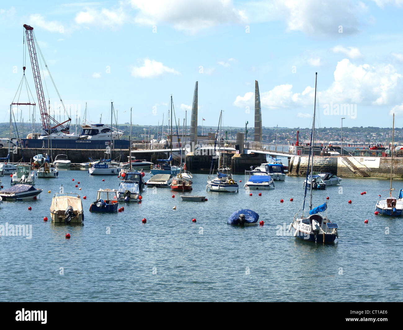 Torquay harbour and the famous footbridge to the outer marina at ...