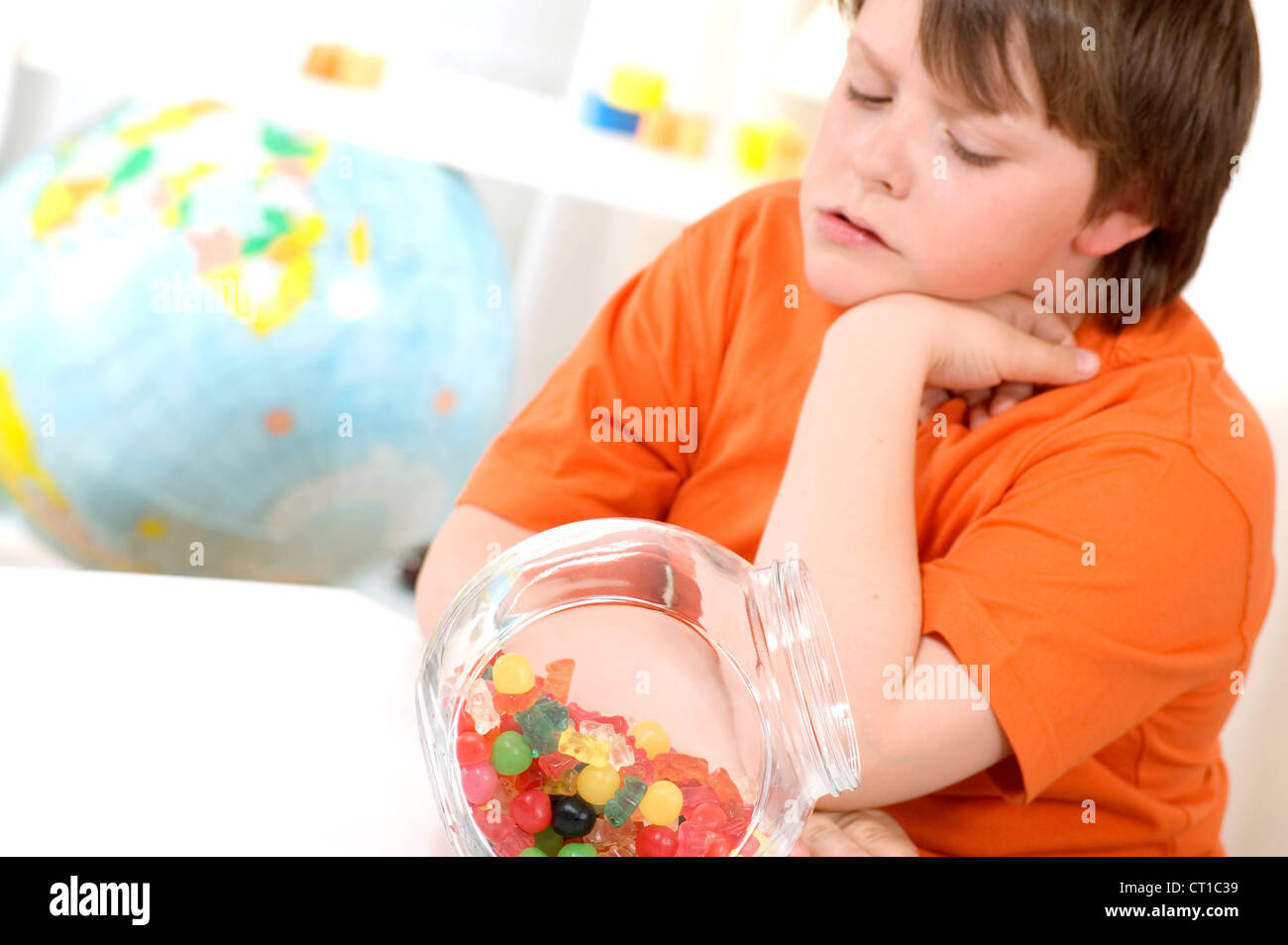 CHILD EATING SWEETS Stock Photo - Alamy