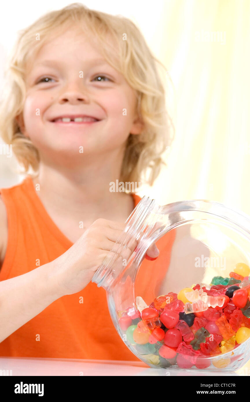 CHILD EATING SWEETS Stock Photo - Alamy