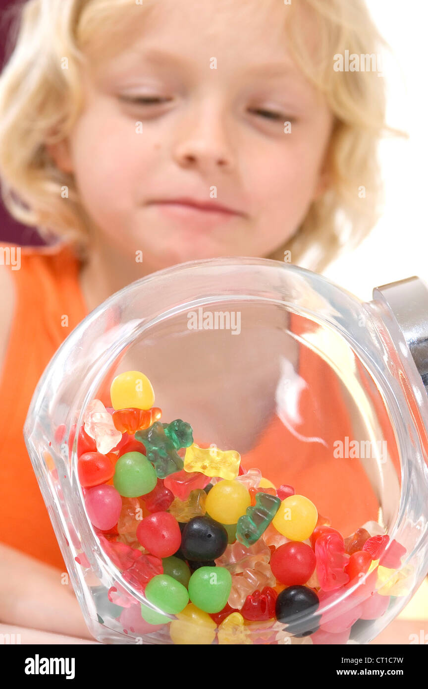 CHILD EATING SWEETS Stock Photo - Alamy