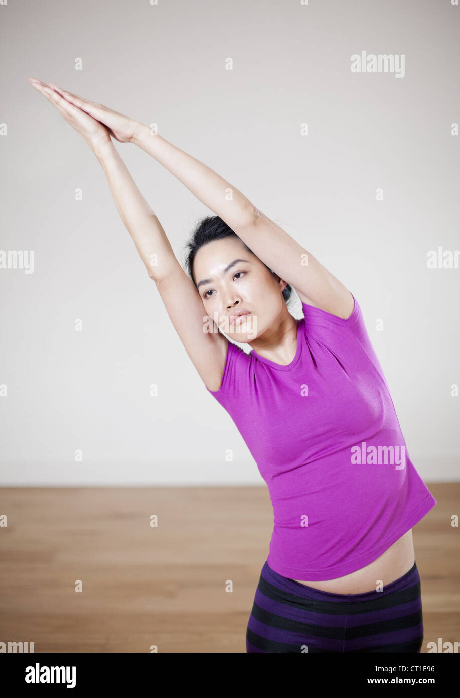 Woman stretching indoors Stock Photo - Alamy