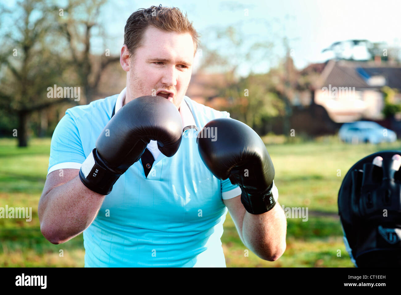 Boxer training with coach outdoors Stock Photo - Alamy