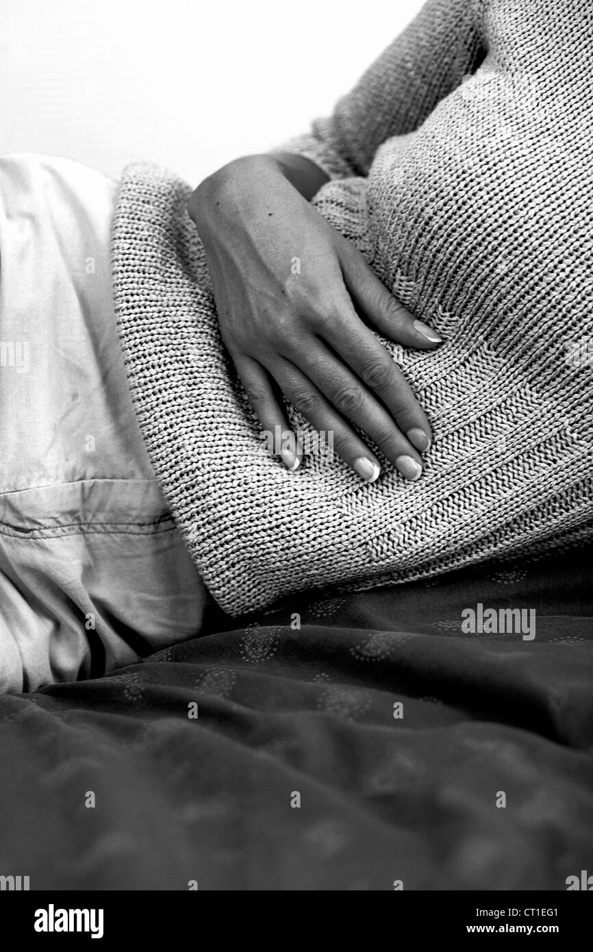 Pain stomach woman not pregnant Black and White Stock Photos & Images ...