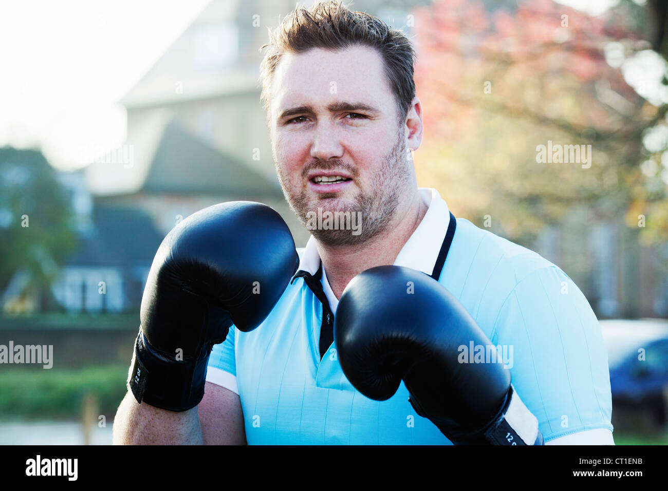 Man holding boxing gloves hi-res stock photography and images - Alamy