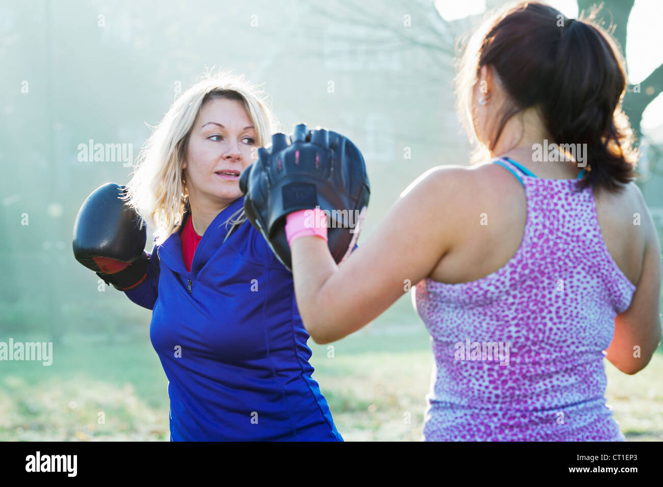 Boxer training with coach outdoors Stock Photo - Alamy
