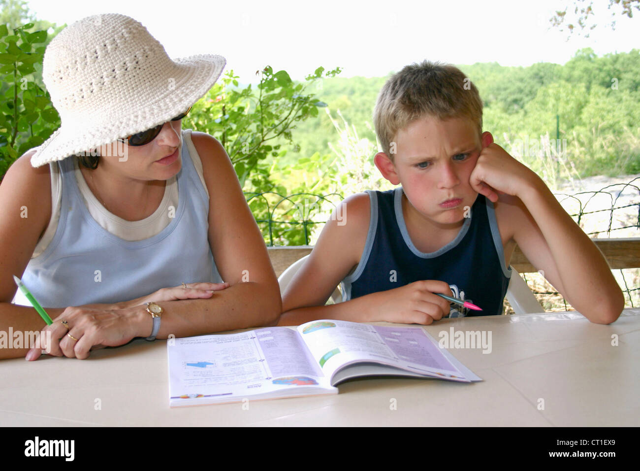 CHILD DOING HOMEWORK OUTDOORS Stock Photo - Alamy