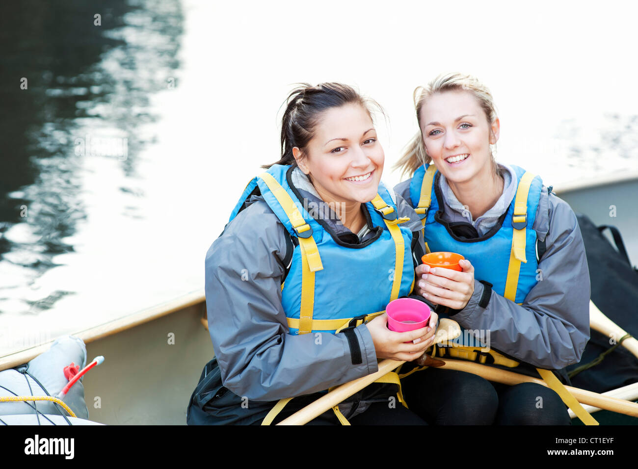 Women having coffee in canoe Stock Photo - Alamy