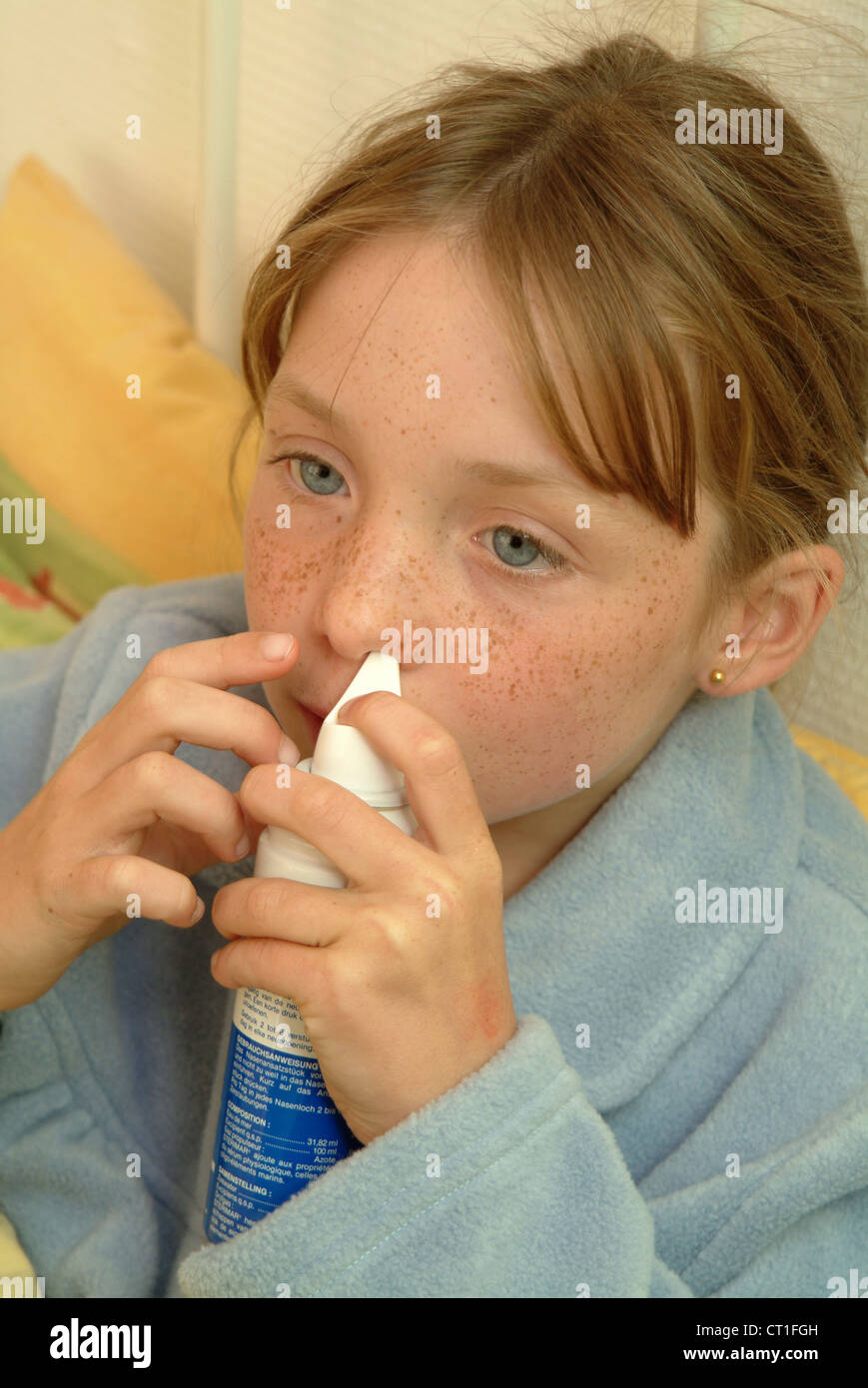 CHILD USING NOSE SPRAY Stock Photo - Alamy