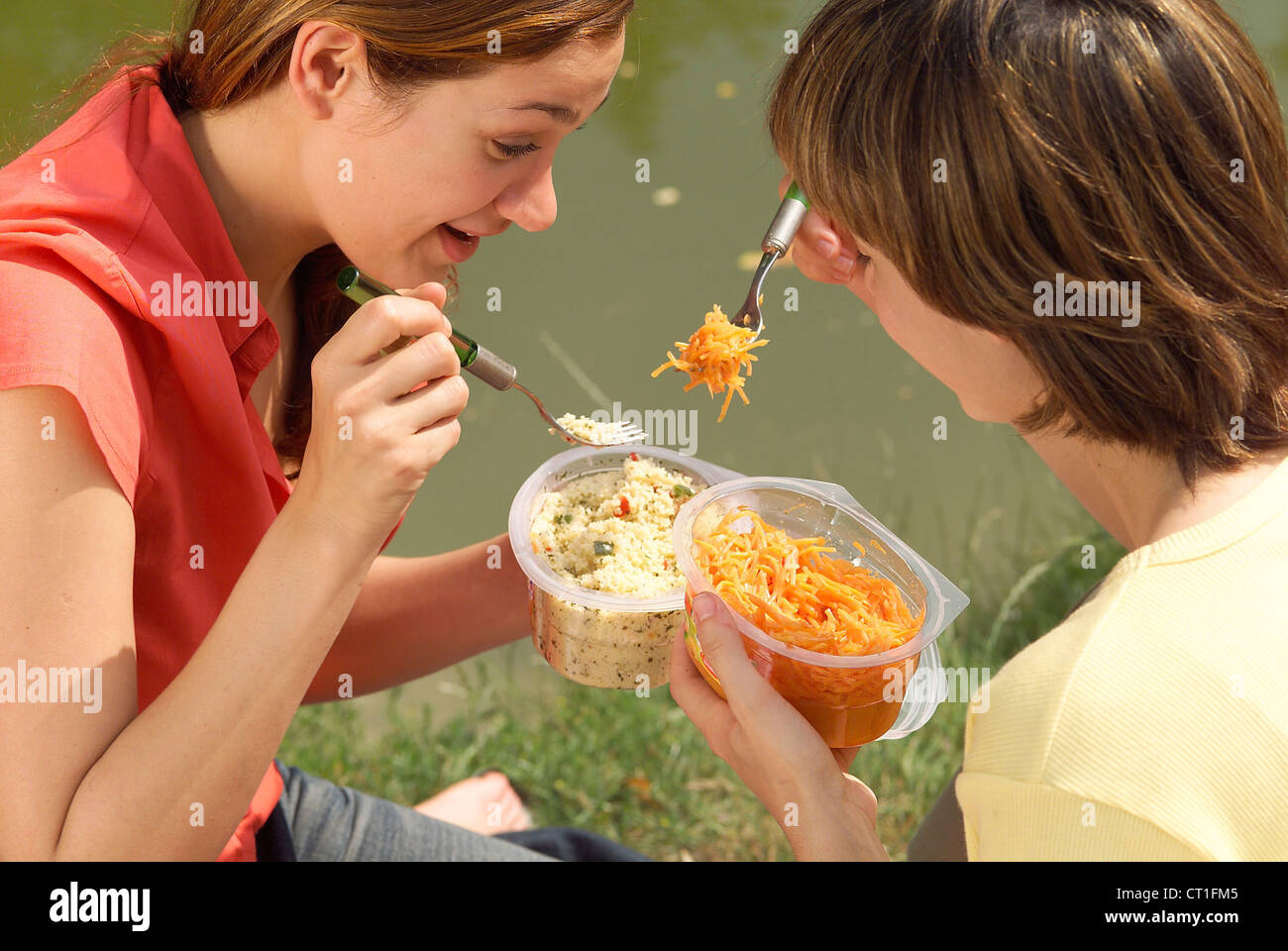 WOMAN EATING RAW VEGETABLES Stock Photo - Alamy