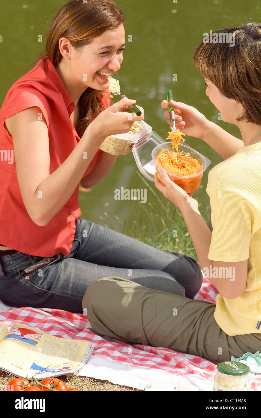WOMAN EATING RAW VEGETABLES Stock Photo - Alamy