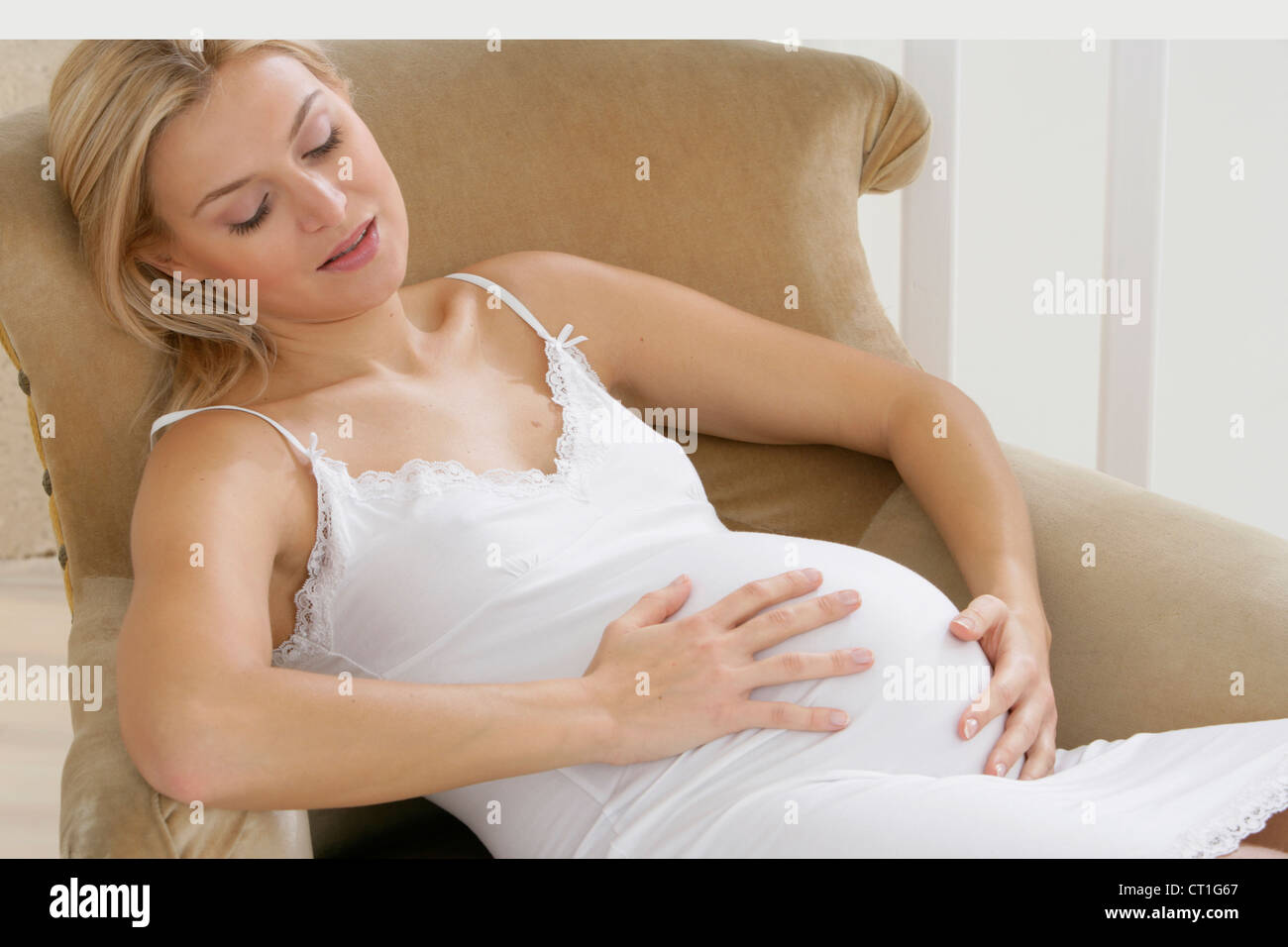 PREGNANT WOMAN RESTING Stock Photo - Alamy