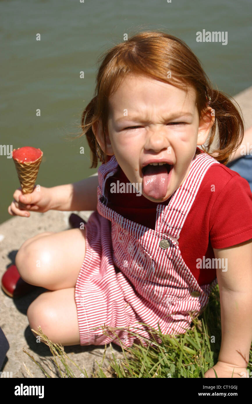 CHILD EATING SWEETS Stock Photo - Alamy