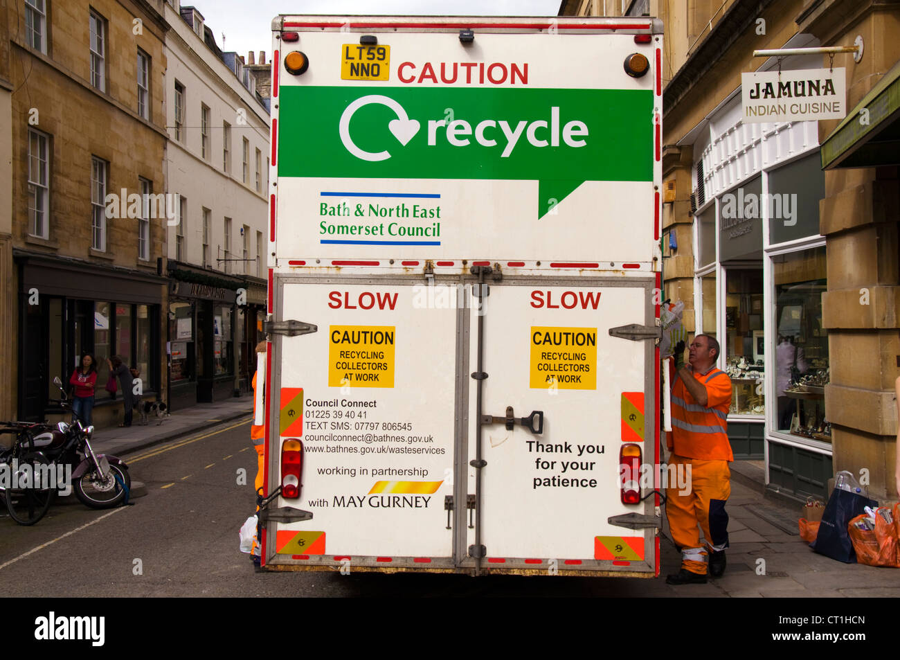 Man working with recycling truck Stock Photo - Alamy