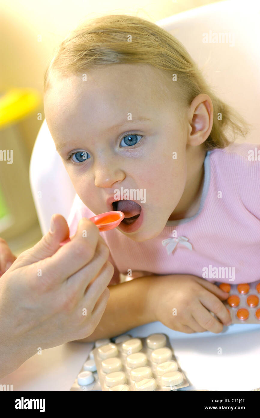 CHILD TAKING MEDICATION Stock Photo - Alamy