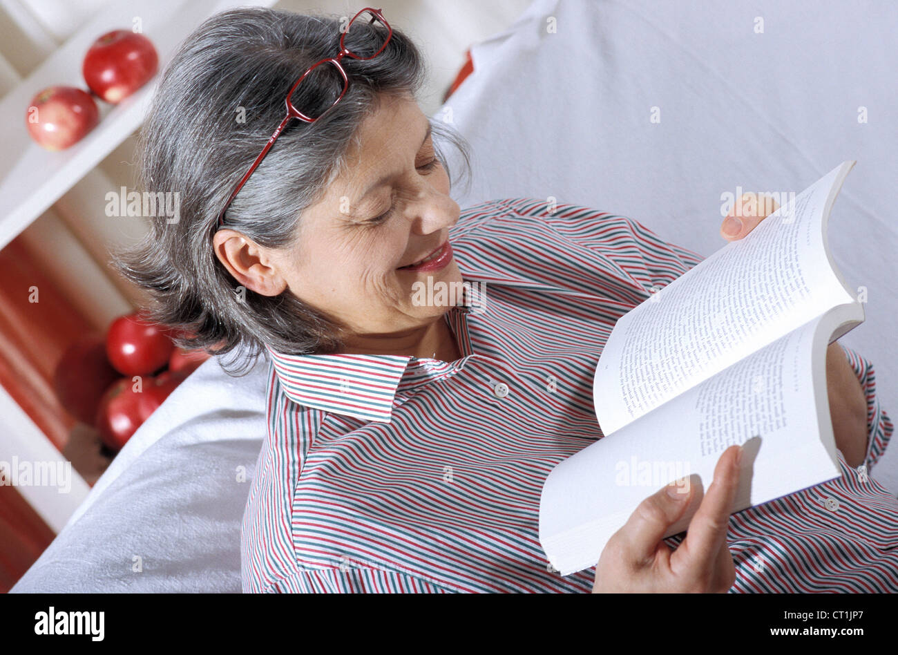 ELDERLY PERSON READING Stock Photo - Alamy