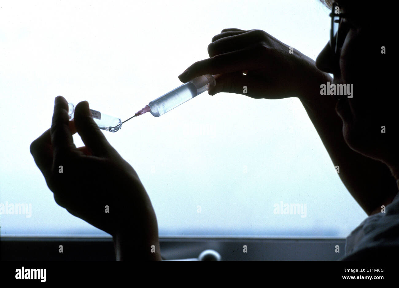 Close up person injecting syringe hi-res stock photography and images ...