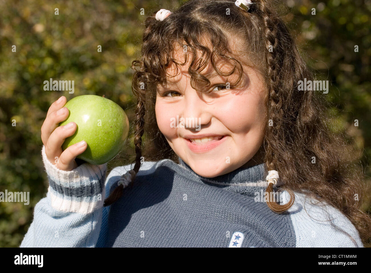 CHILD EATING FRUIT Stock Photo - Alamy