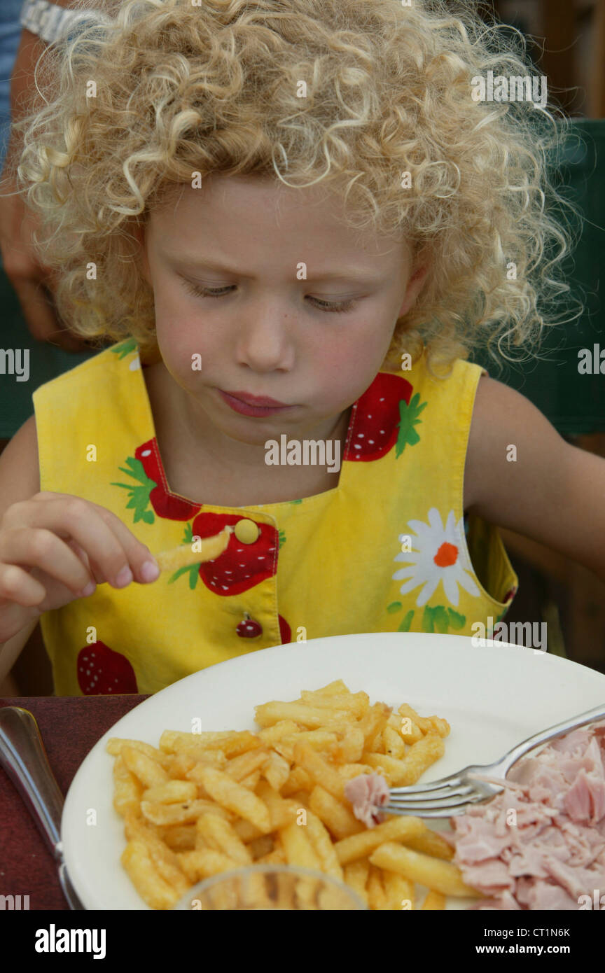 CHILD EATING A MEAL Stock Photo - Alamy