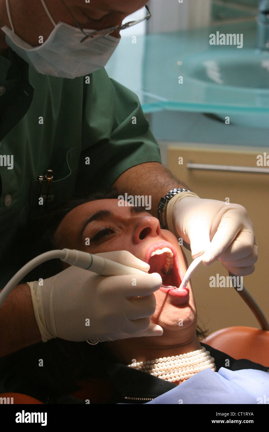 WOMAN RECEIVING DENTAL CARE Stock Photo - Alamy