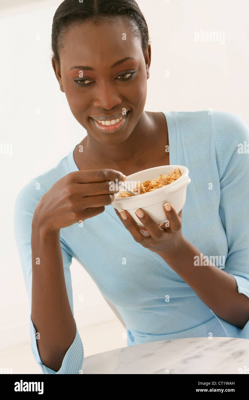 WOMAN EATING BREAKFAST Stock Photo - Alamy
