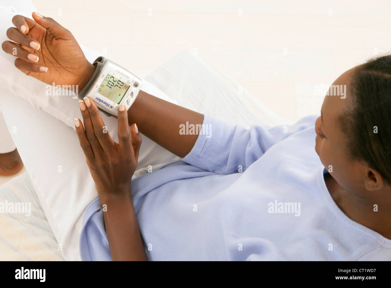 BLOOD PRESSURE, WOMAN Stock Photo - Alamy