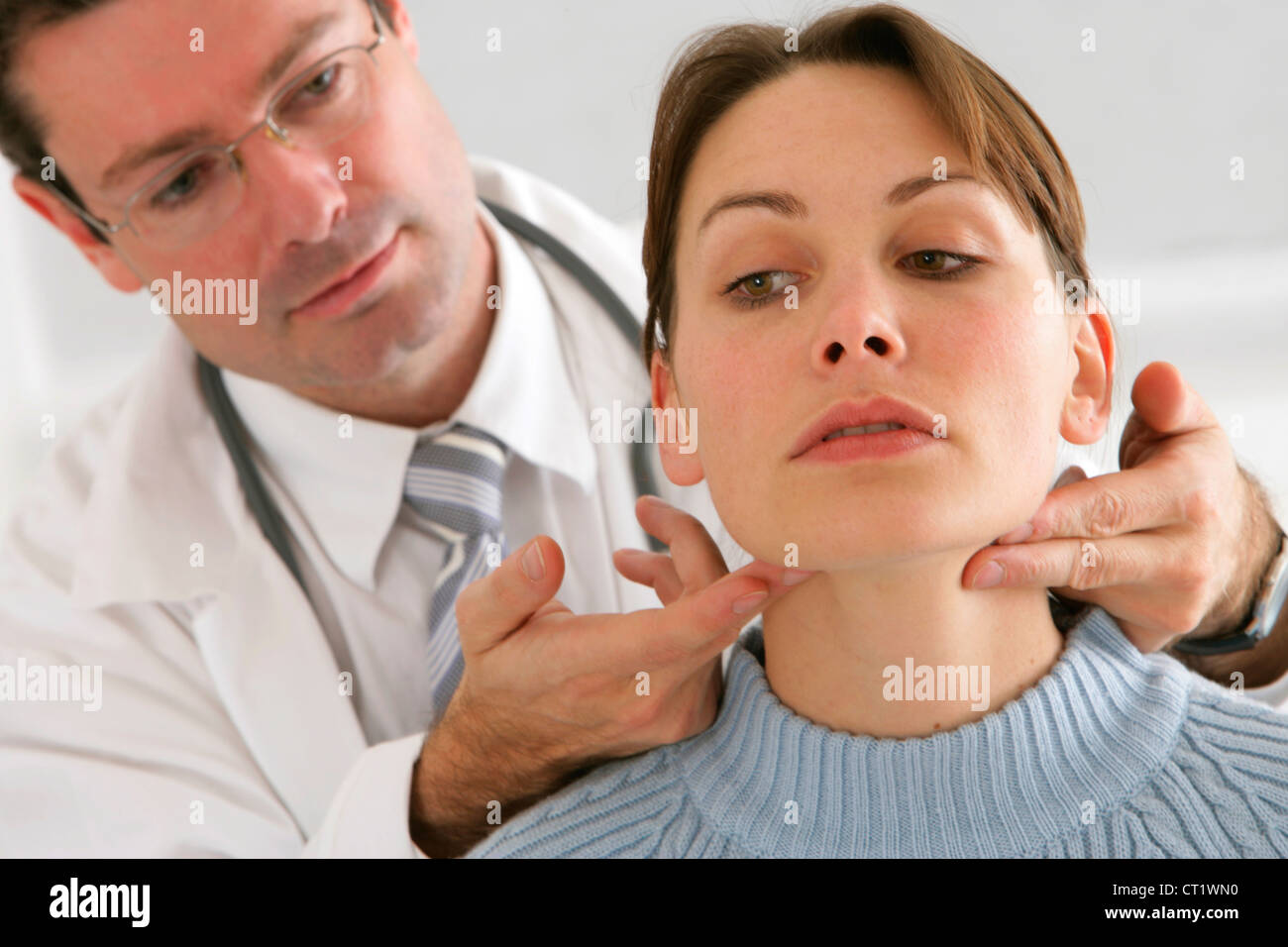 WOMAN PALPATING LYMPH NODE Stock Photo - Alamy