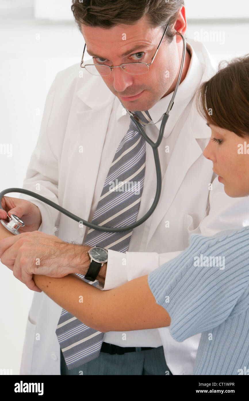 TAKING A WOMAN'S PULSE Stock Photo - Alamy