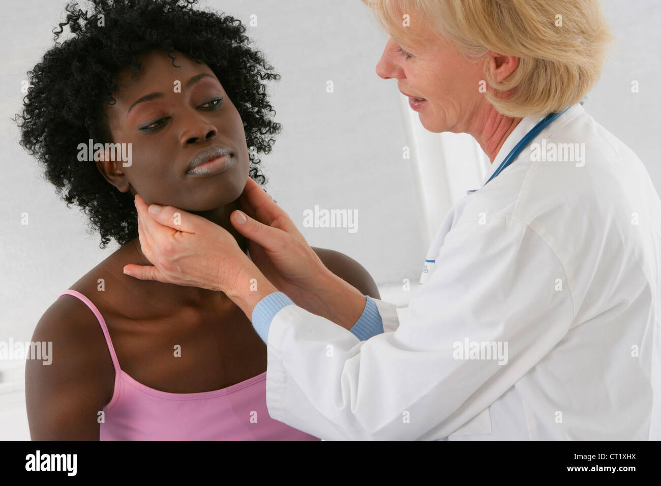 WOMAN PALPATING LYMPH NODE Stock Photo - Alamy