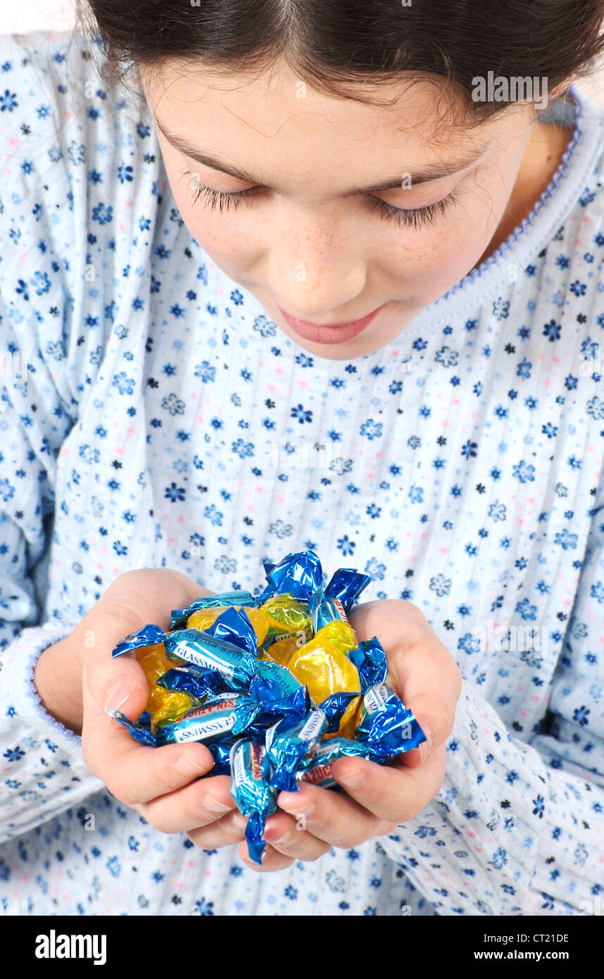 CHILD EATING SWEETS Stock Photo - Alamy