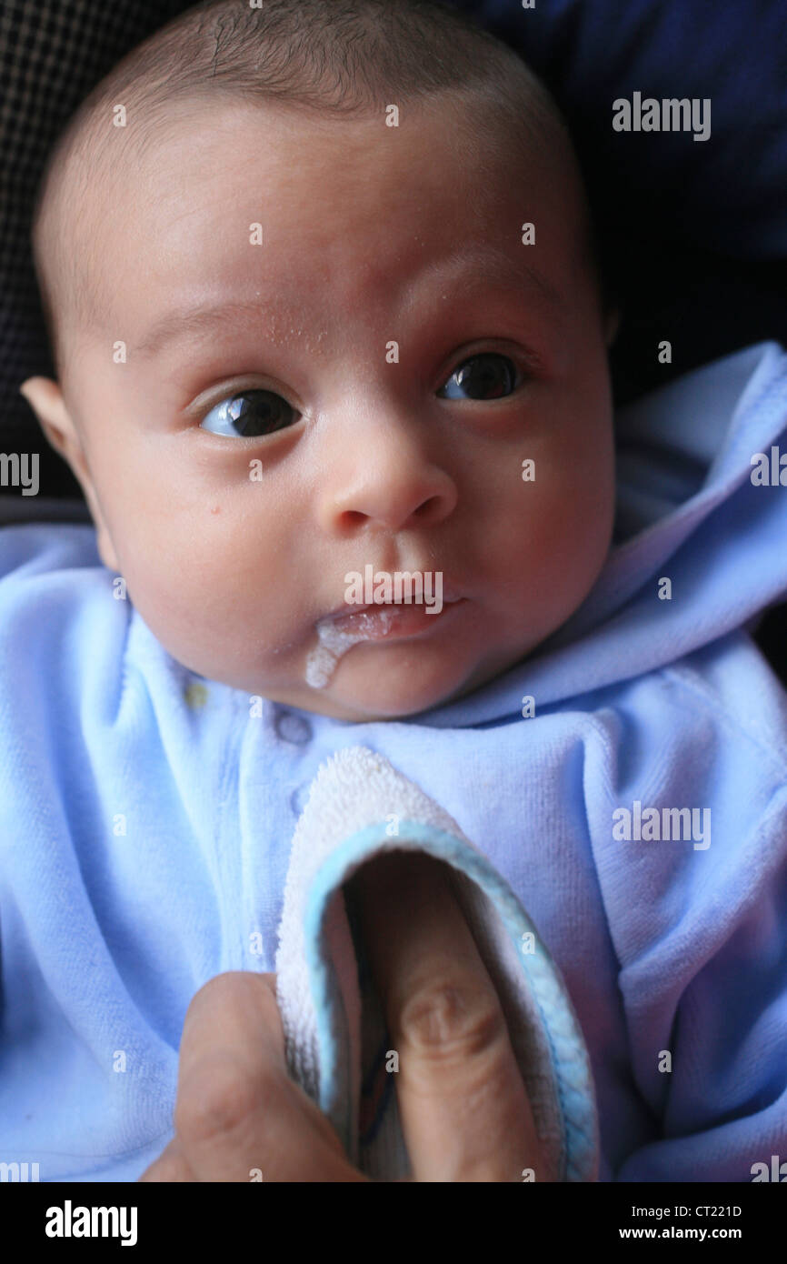 REGURGITATION IN AN INFANT Stock Photo - Alamy