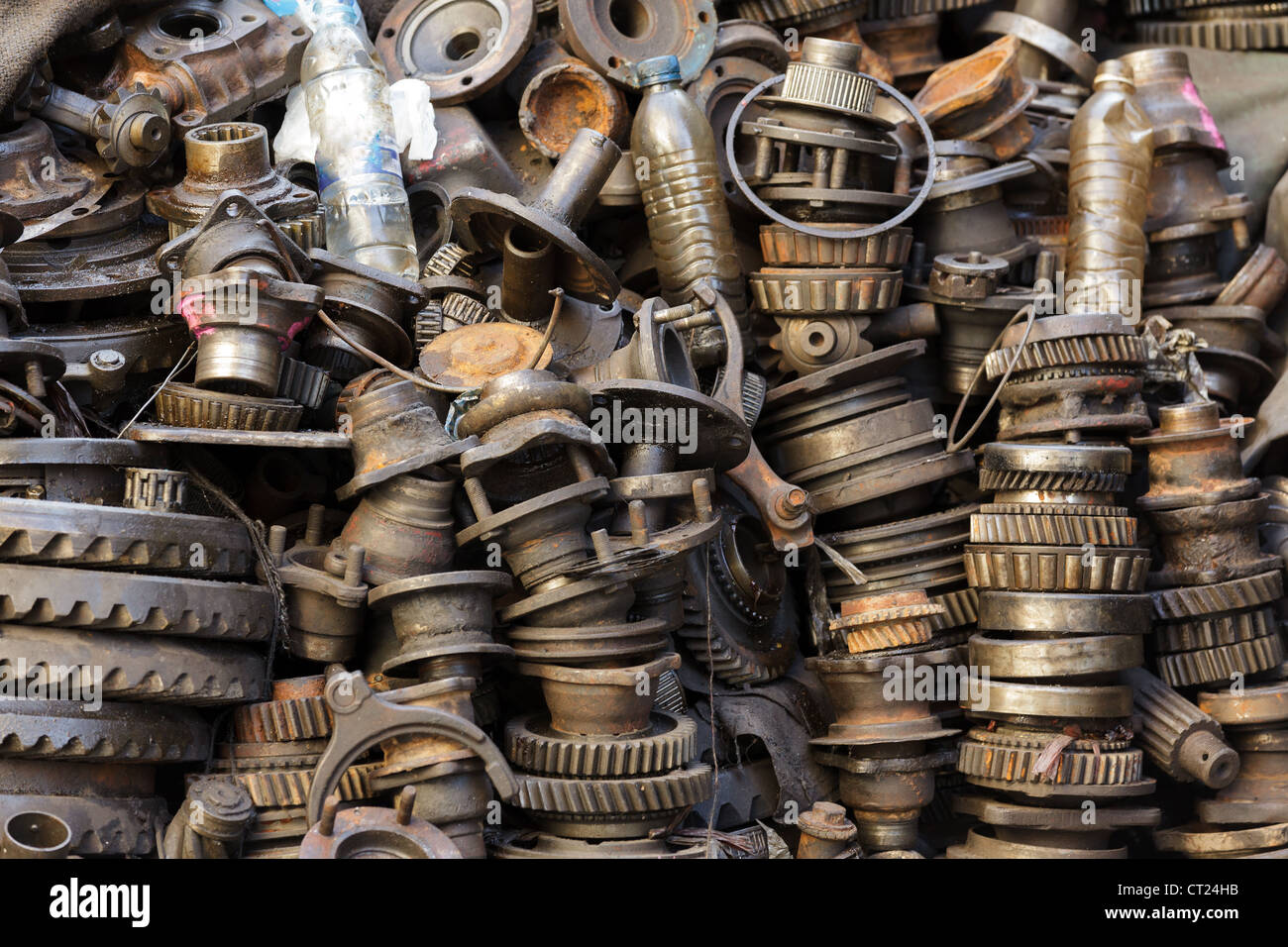 stack of rusted metallic car parts in garage Stock Photo - Alamy