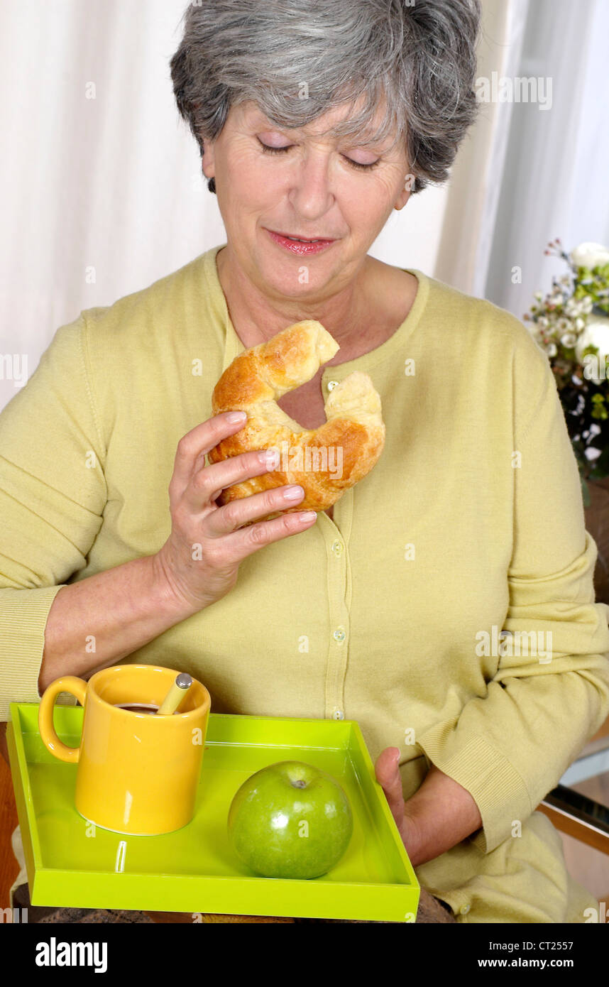 ELDERLY PERSON EATING BREAKFAST Stock Photo - Alamy