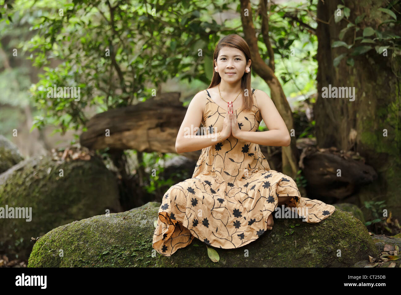 young asian woman meditating in tropical nature, thailand Stock Photo ...
