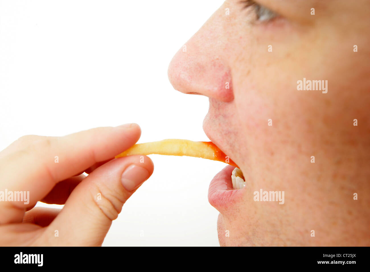 MAN EATING STARCHY FOOD Stock Photo - Alamy