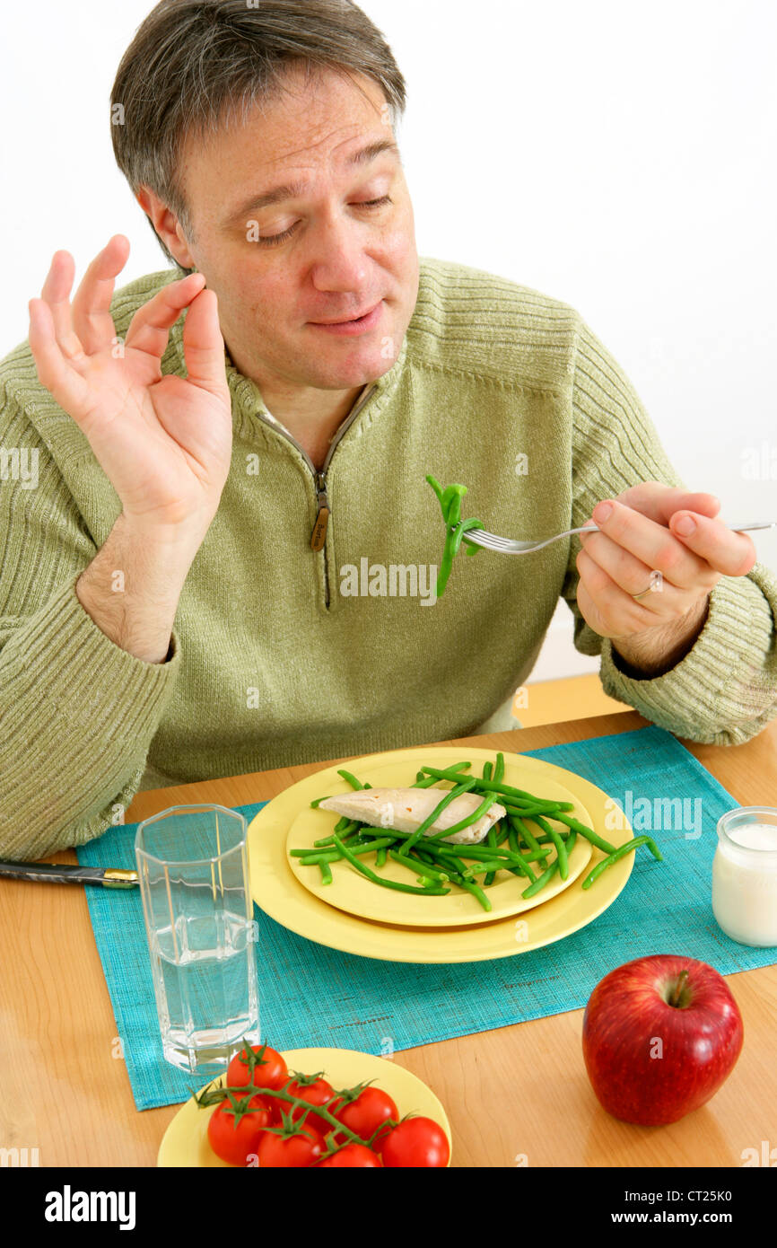 MAN EATING MEAT Stock Photo - Alamy
