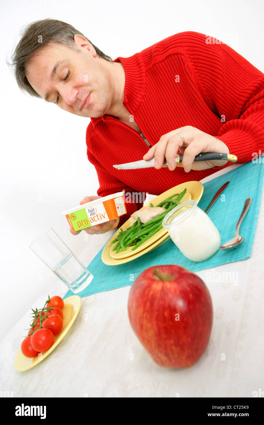 MAN EATING MEAT Stock Photo - Alamy