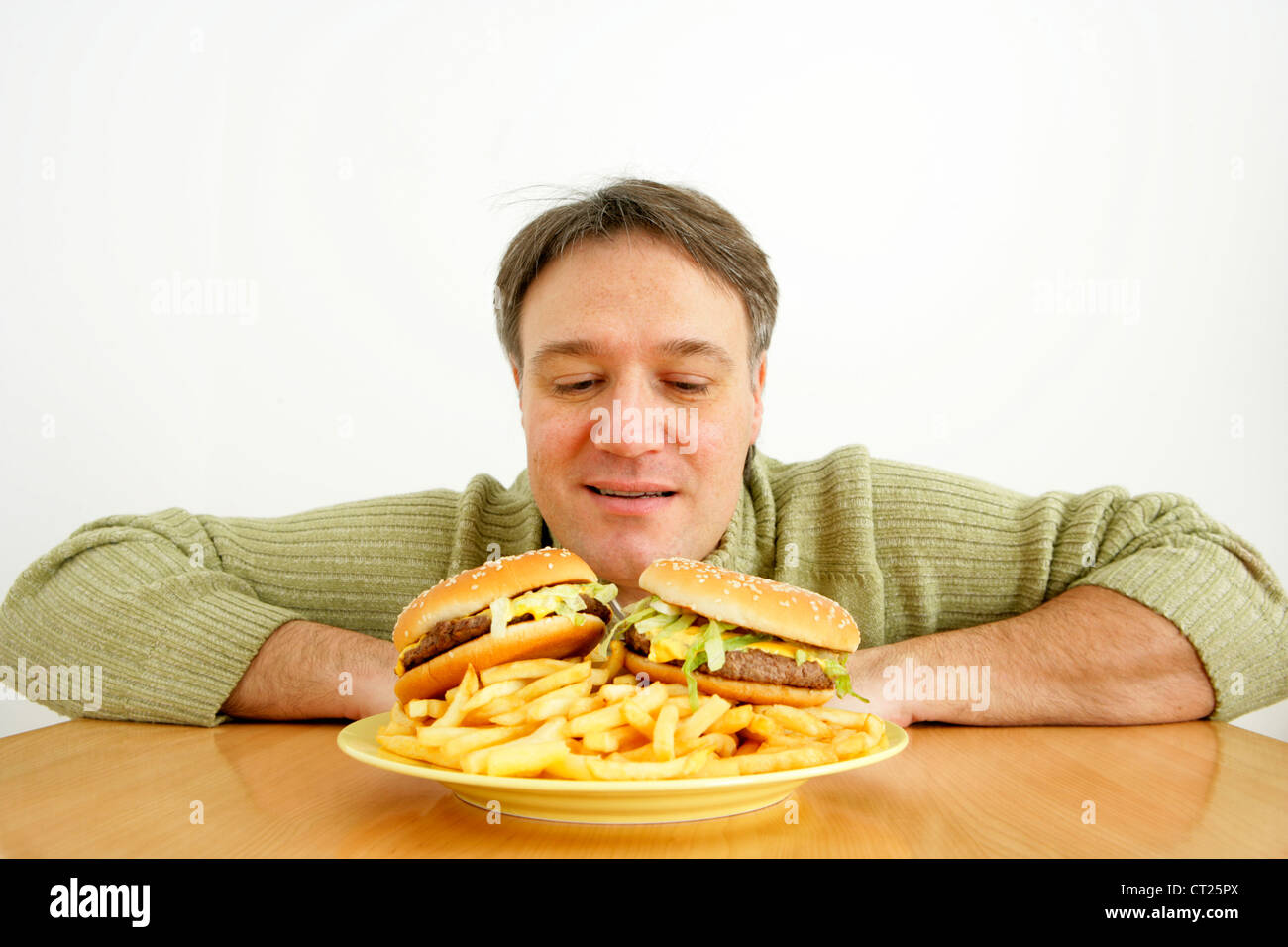 Man and plate of food plain background hi-res stock photography and ...