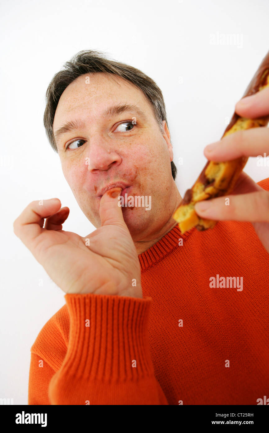 Man cake greed hi-res stock photography and images - Alamy