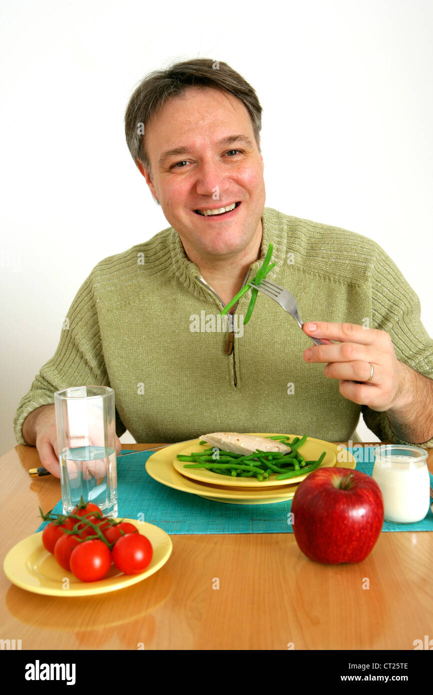 MAN EATING MEAT Stock Photo - Alamy