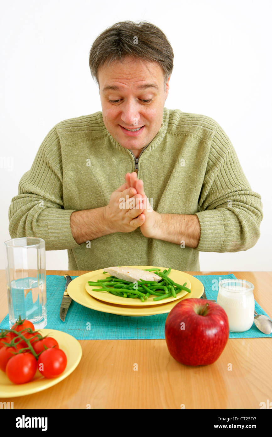 MAN EATING MEAT Stock Photo - Alamy
