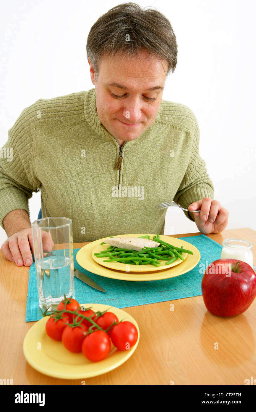 MAN EATING MEAT Stock Photo - Alamy