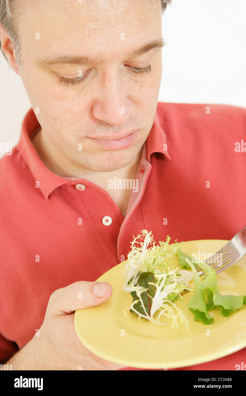MAN EATING SALAD Stock Photo - Alamy