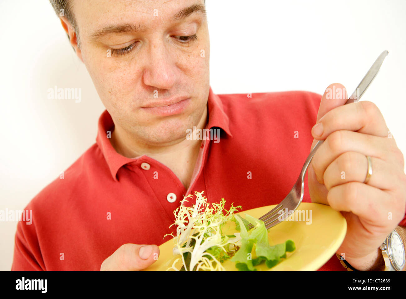 Man eating salad disgust hi-res stock photography and images - Alamy
