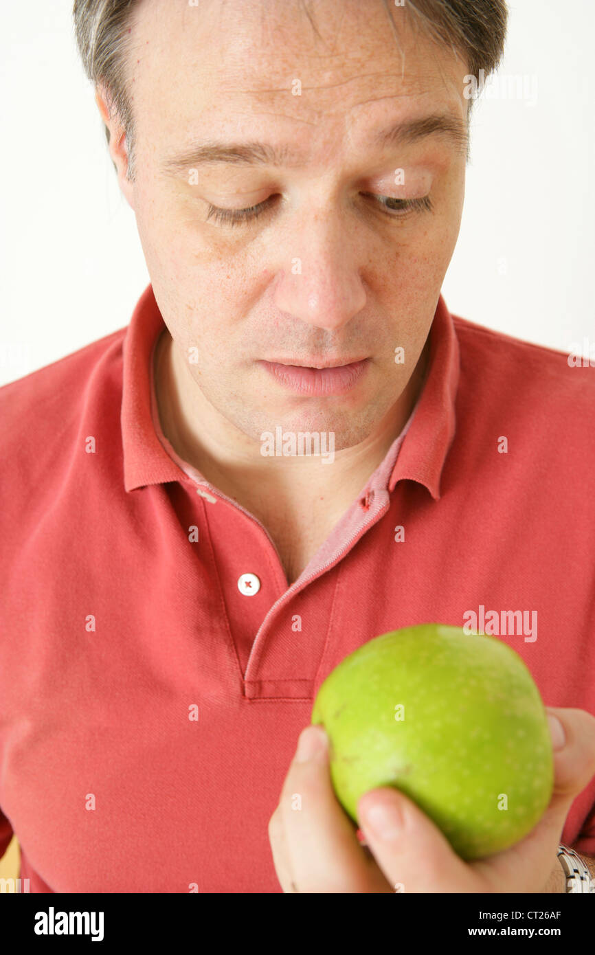 MAN EATING FRUIT Stock Photo - Alamy