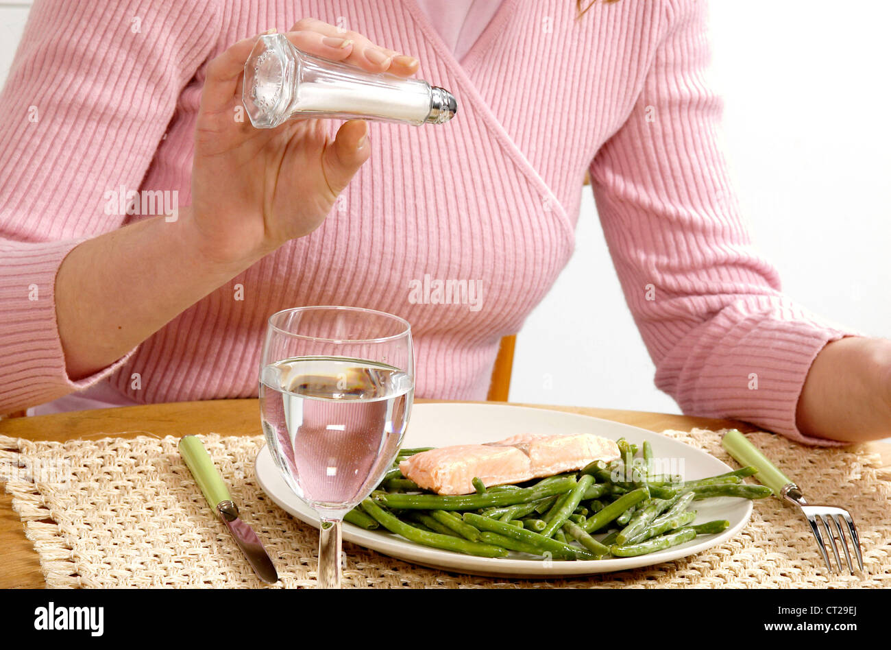 Woman eating fatty fish hi-res stock photography and images - Alamy