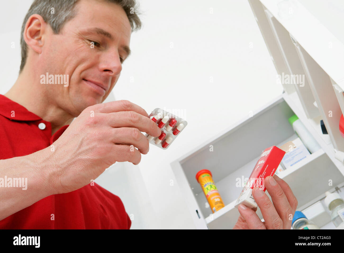 MAN TAKING MEDICATION Stock Photo - Alamy