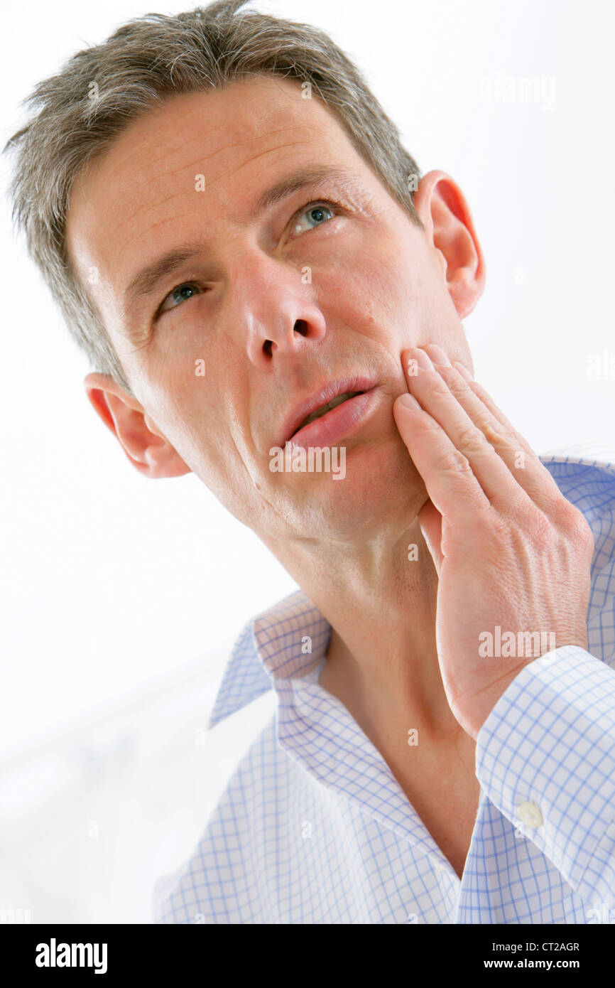 MAN WITH TOOTHACHE Stock Photo - Alamy
