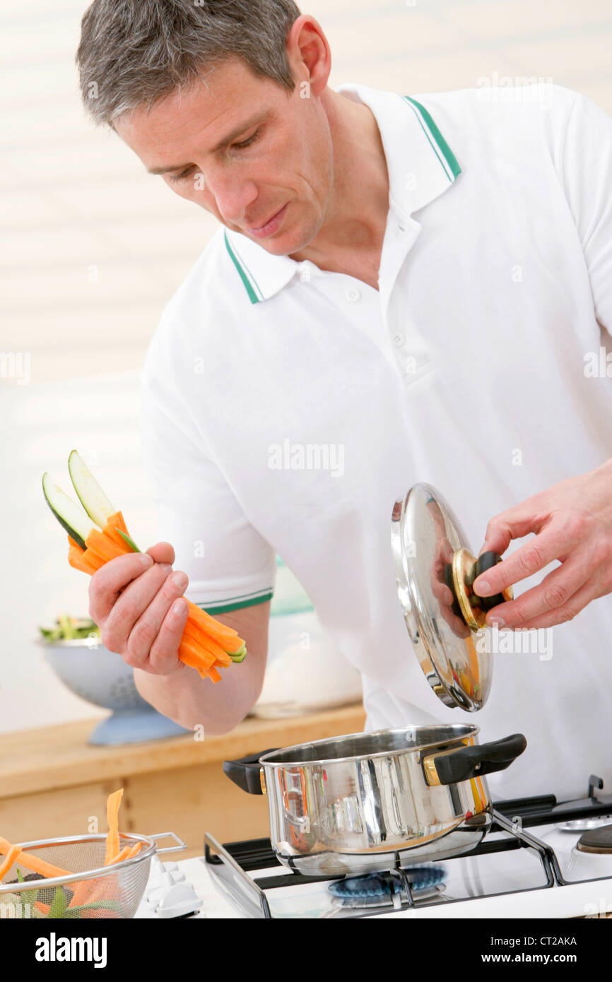 MAN IN KITCHEN Stock Photo - Alamy