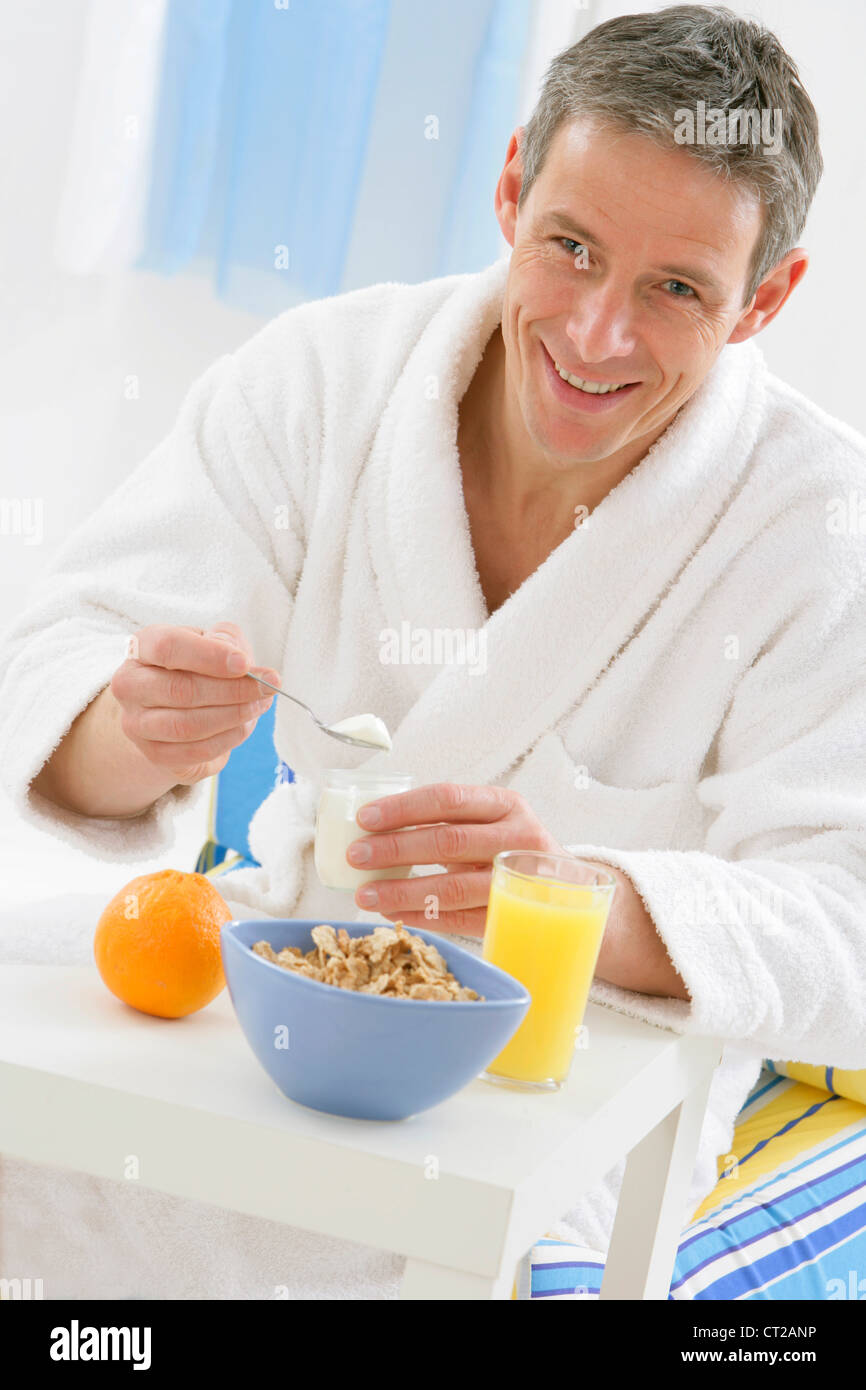 MAN EATING BREAKFAST Stock Photo - Alamy